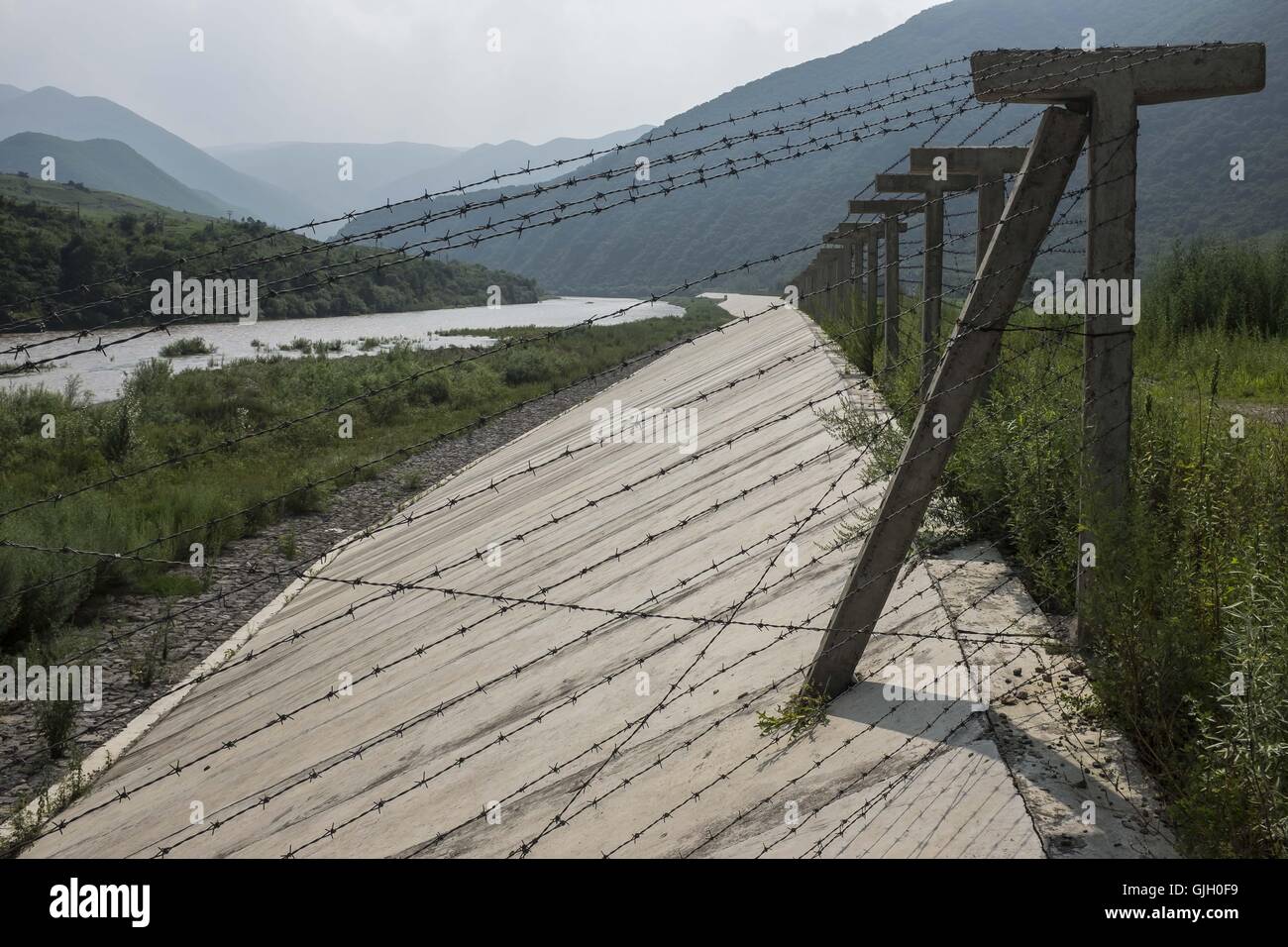 Tumen, Helong, Jilin, China. 30th July, 2016. Barbed-wire fence near ...