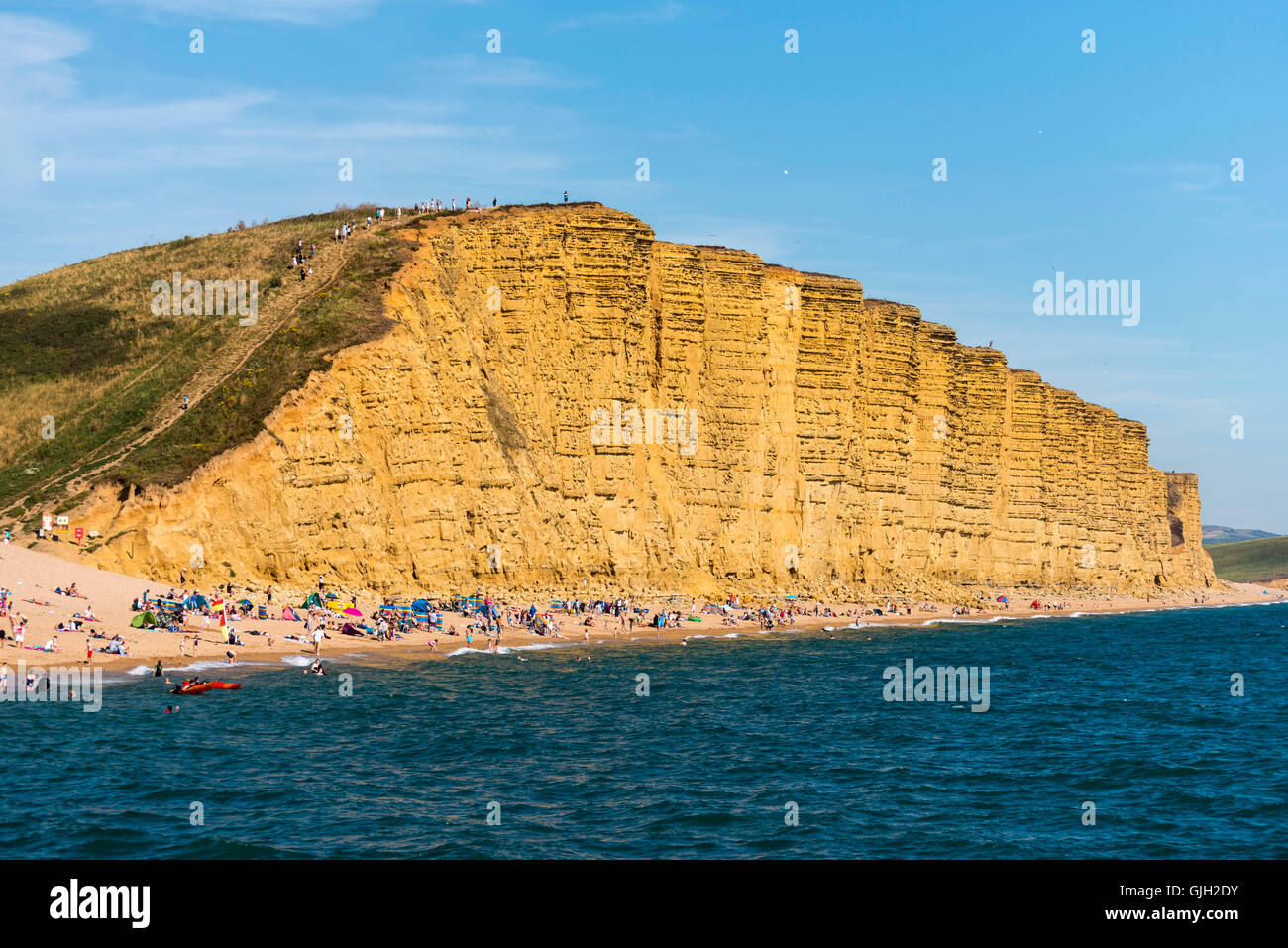 West Bay, Dorset, UK. 16th August, 2016. Landslide danger. A packed ...