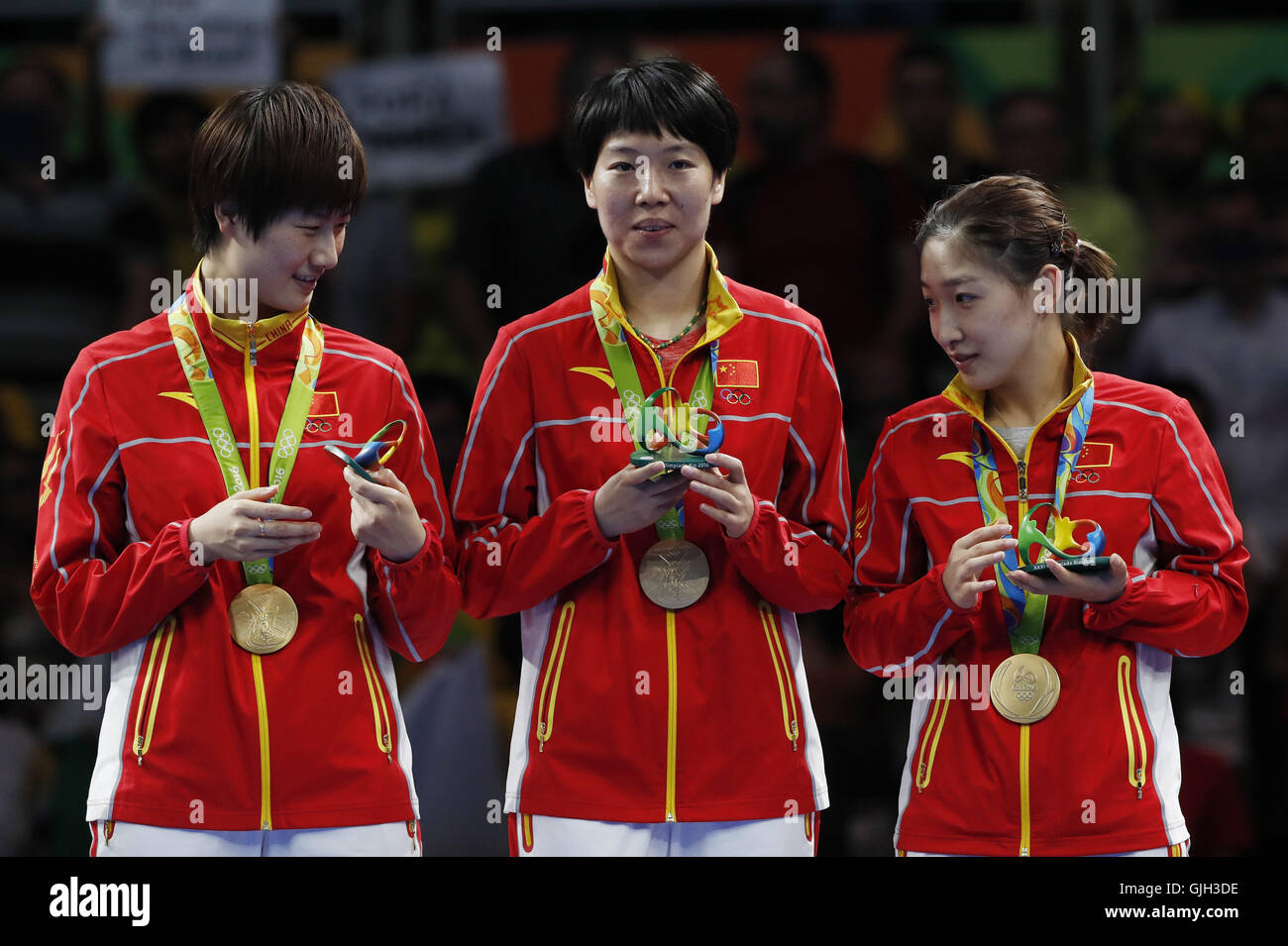 Rio De Janeiro, Brazil. 16th Aug, 2016. China's Ding Ning (L), Li Xiaoxia (C) and Liu Shiwen ...