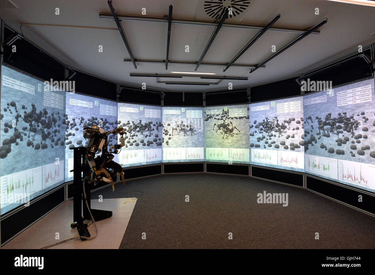 An exoskeleton robot operated by remote control (l) stands ready at the ...