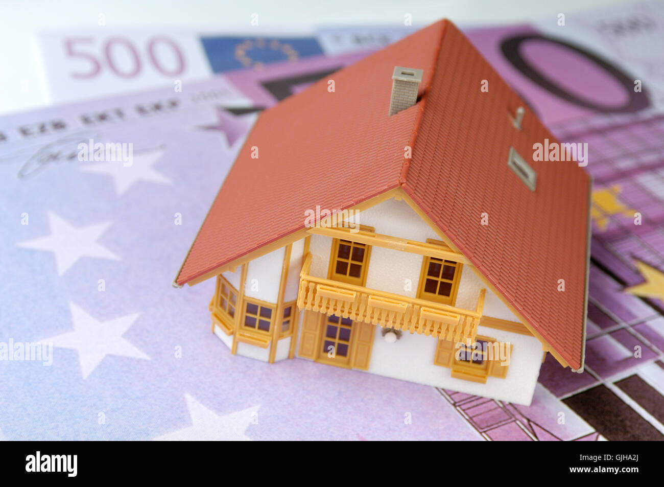 model house on euro notes Stock Photo - Alamy