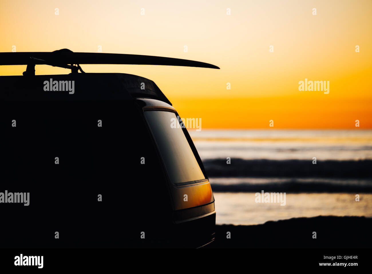 Silhouette of surfboard on Surf Bus at Dusk Stock Photo - Alamy