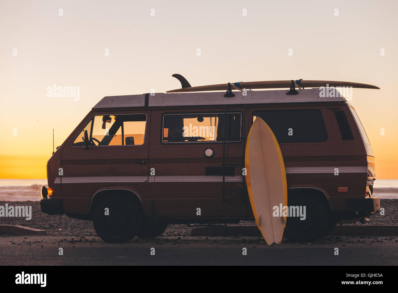 Surfboard leaning against Surf Bus at Sunset, California, United States ...
