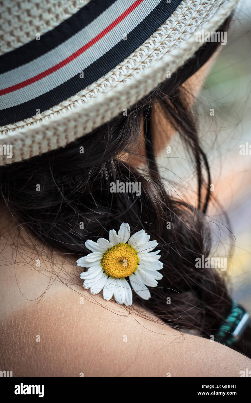Girl with daisy flower in her hair Stock Photo - Alamy