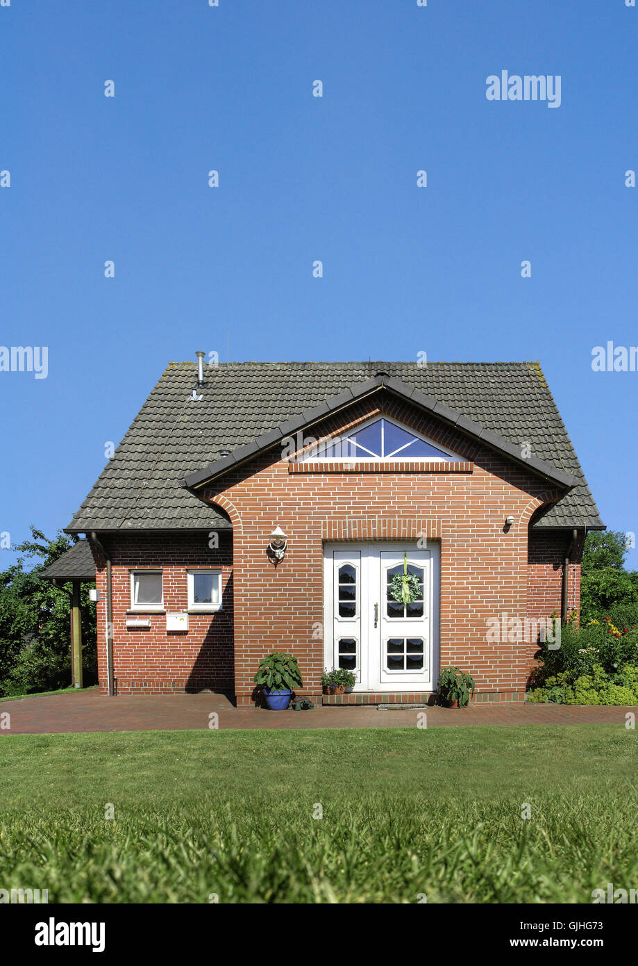 blue house building Stock Photo - Alamy