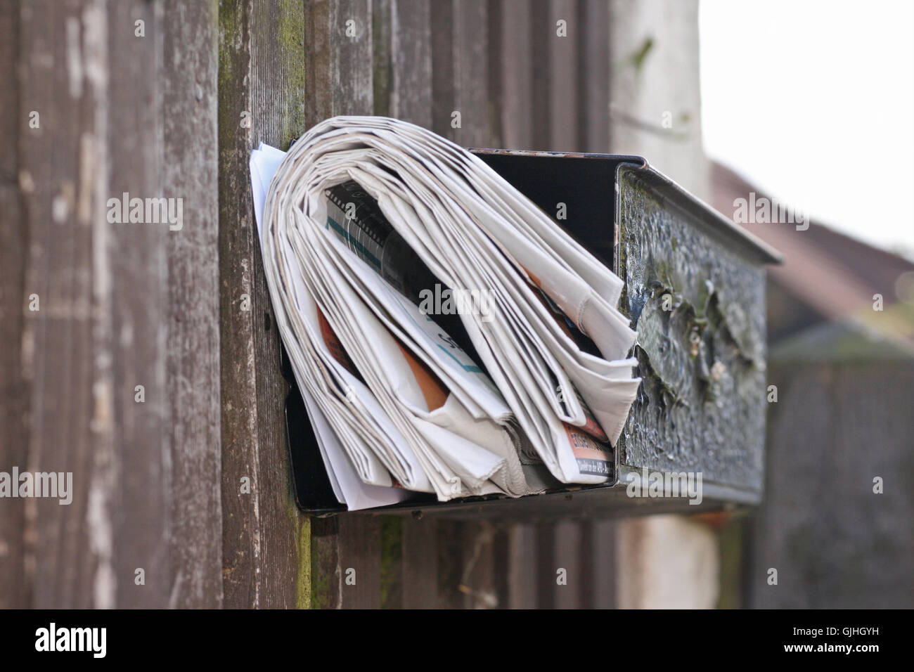newspaper journal fence Stock Photo - Alamy