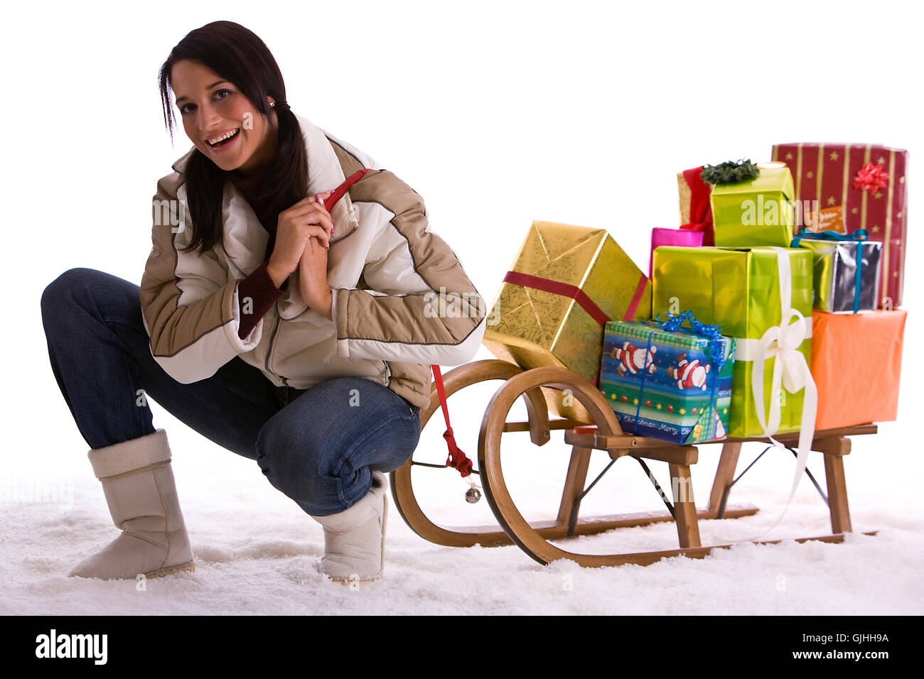 woman pulling sledge with gifts Stock Photo - Alamy