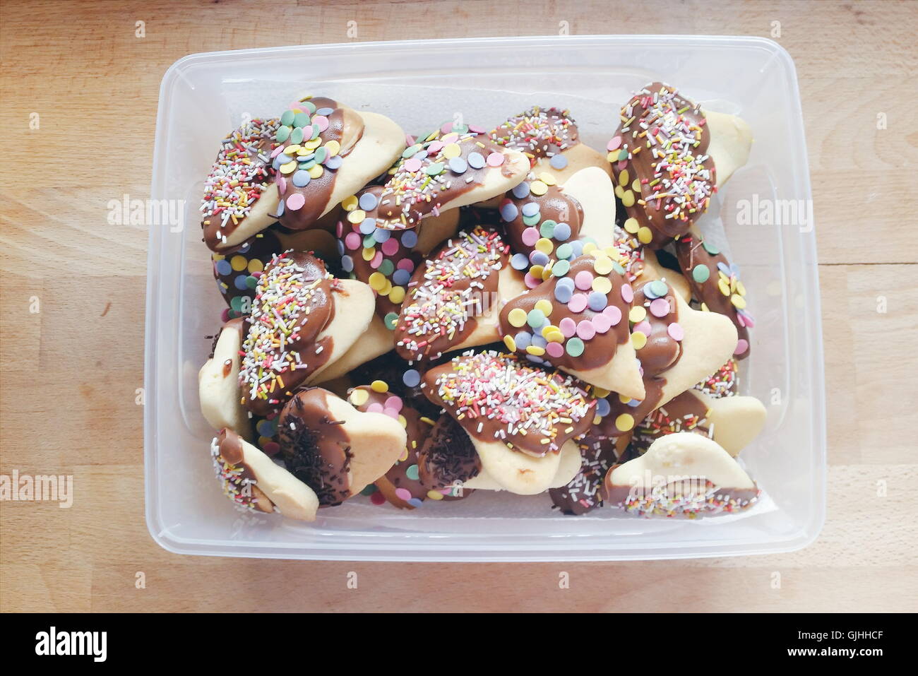 Plastic container with chocolate covered cookies Stock Photo - Alamy