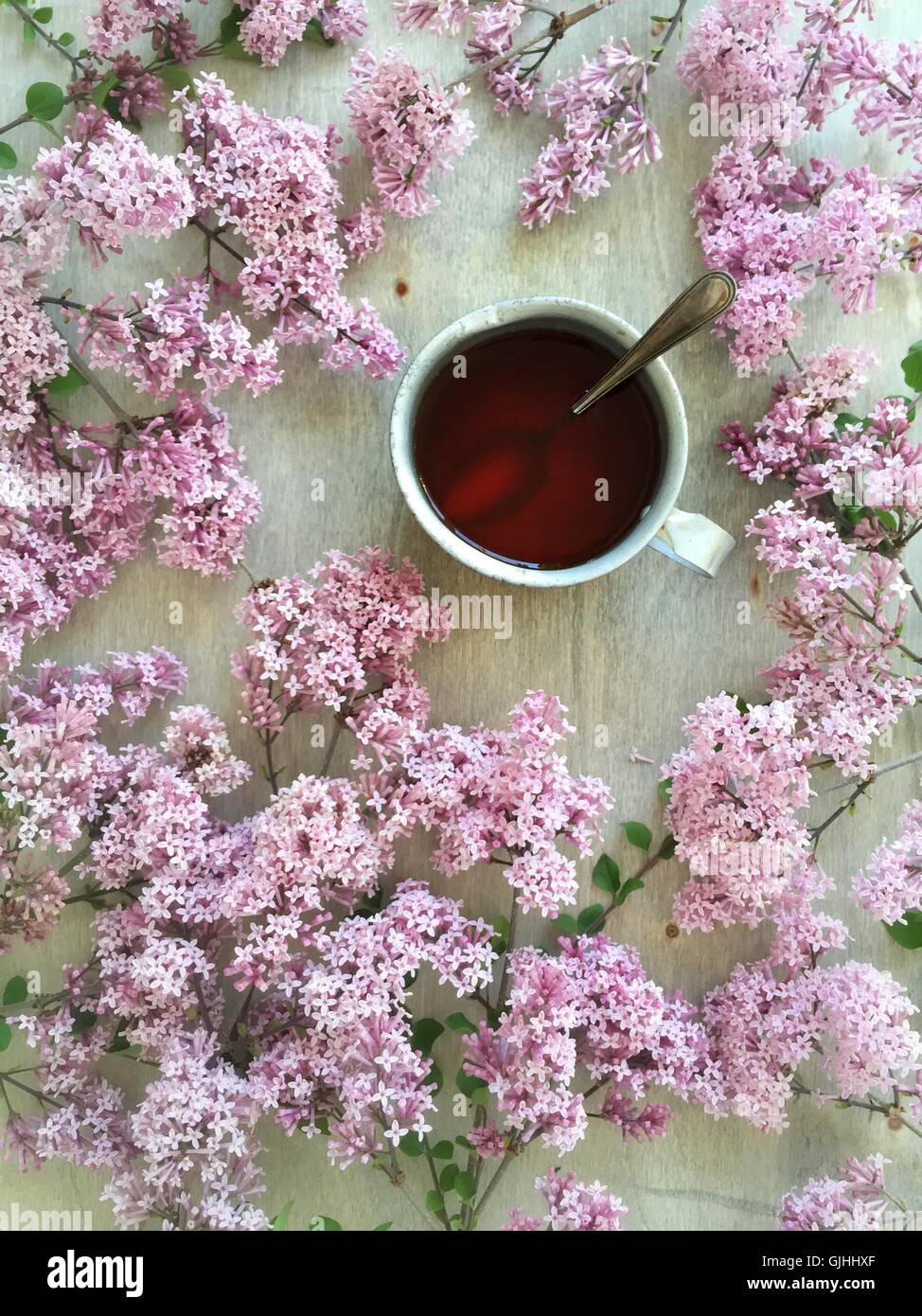 Tea and lilac flowers Stock Photo - Alamy