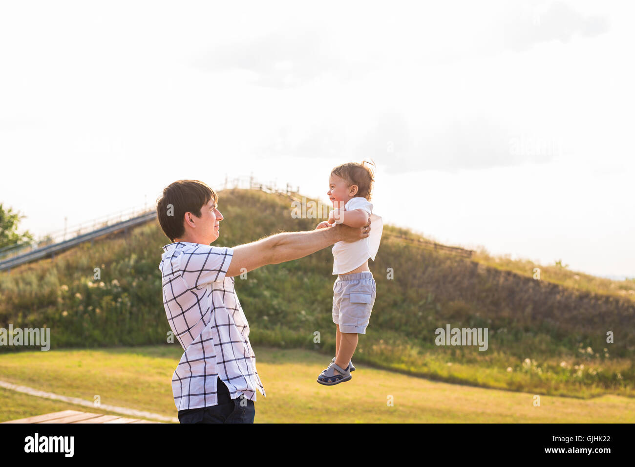 Father holding his baby son Stock Photo - Alamy