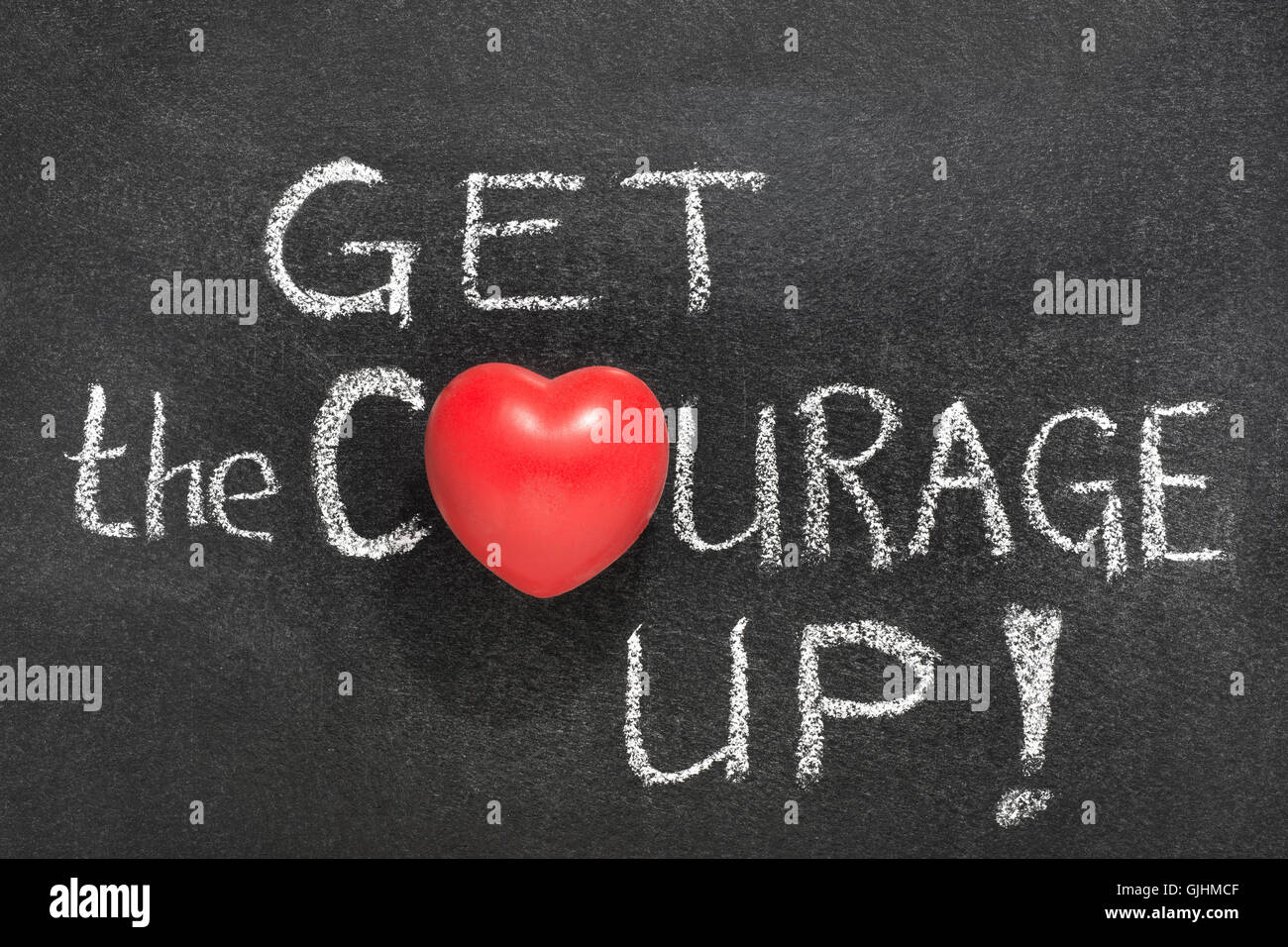 get the courage up exclamation handwritten on blackboard with heart ...