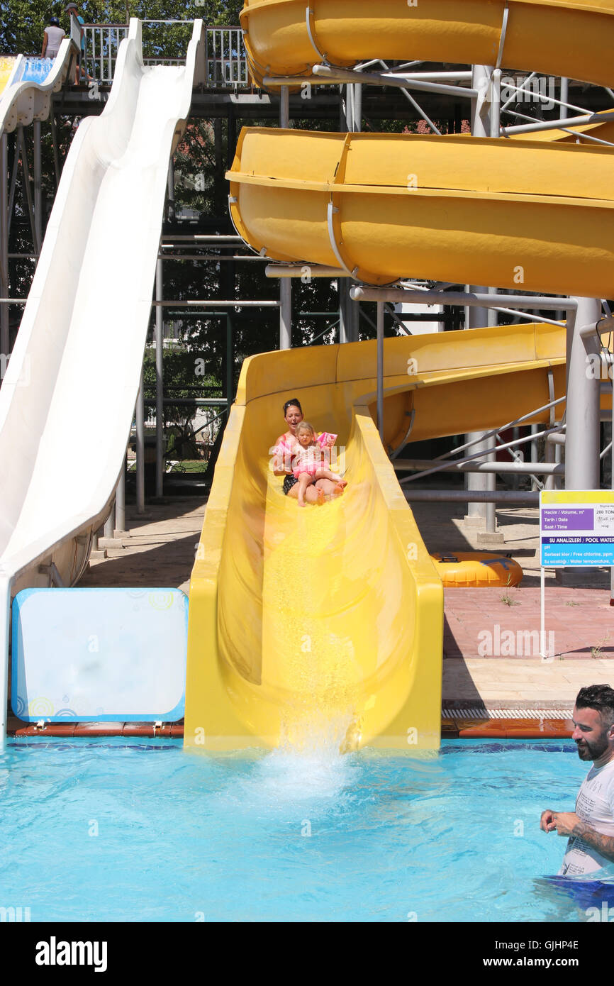 Mother daughter enjoy water slide hi-res stock photography and images ...