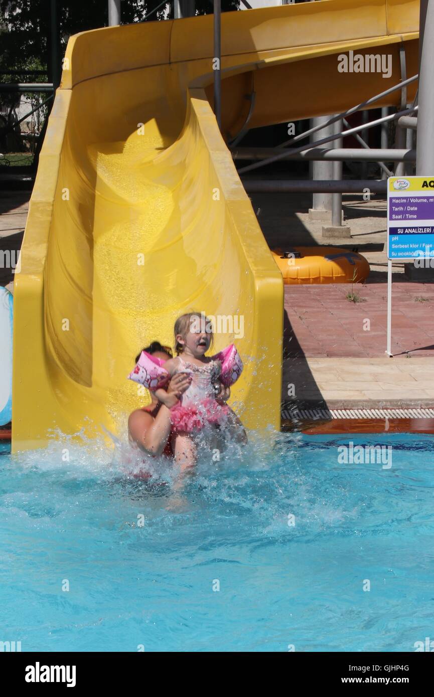 Mother daughter enjoy water slide hi-res stock photography and images ...