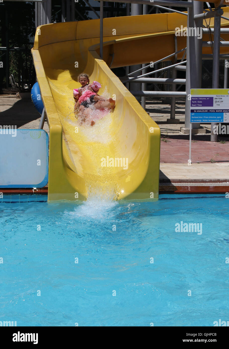 Mother daughter enjoy water slide hi-res stock photography and images ...