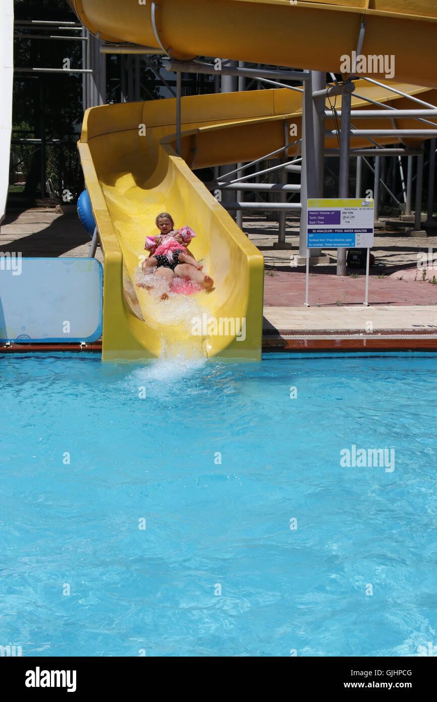 Mother daughter enjoy water slide hi-res stock photography and images ...