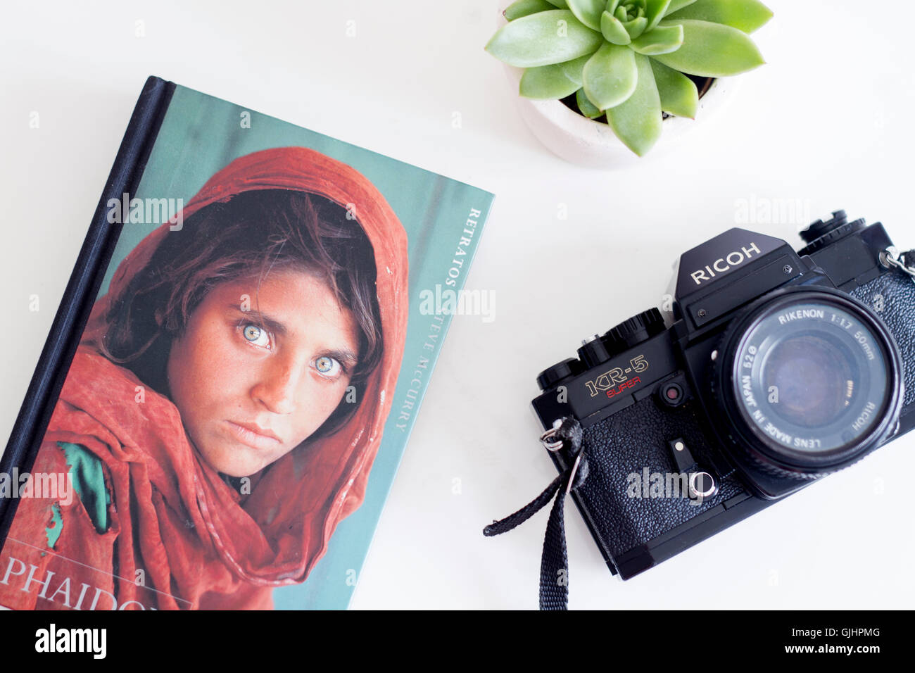 Photography camera and book Stock Photo - Alamy