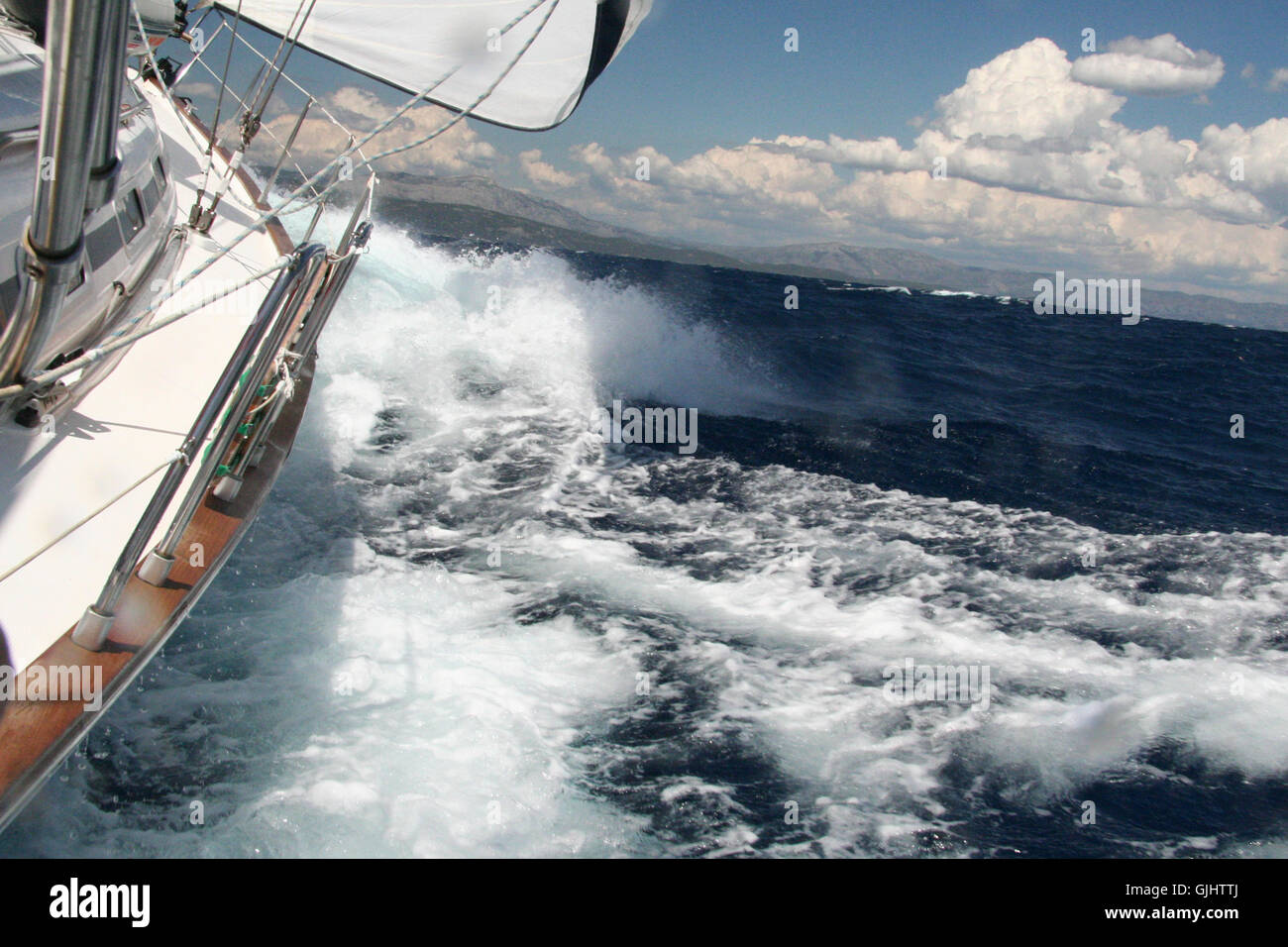 waves sail sailing boat Stock Photo - Alamy