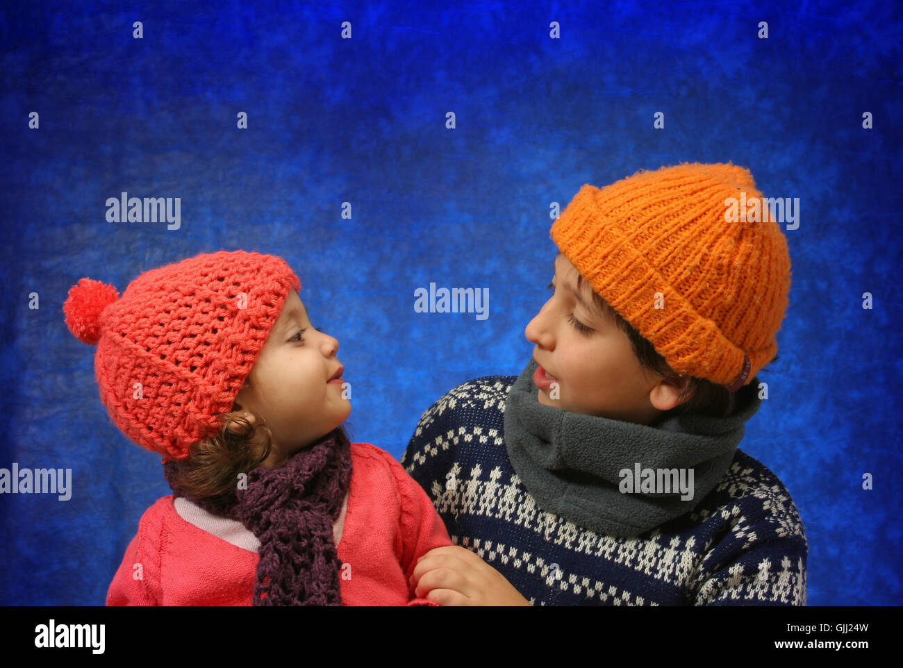 Children warm hats gloves laughing hi-res stock photography and images ...