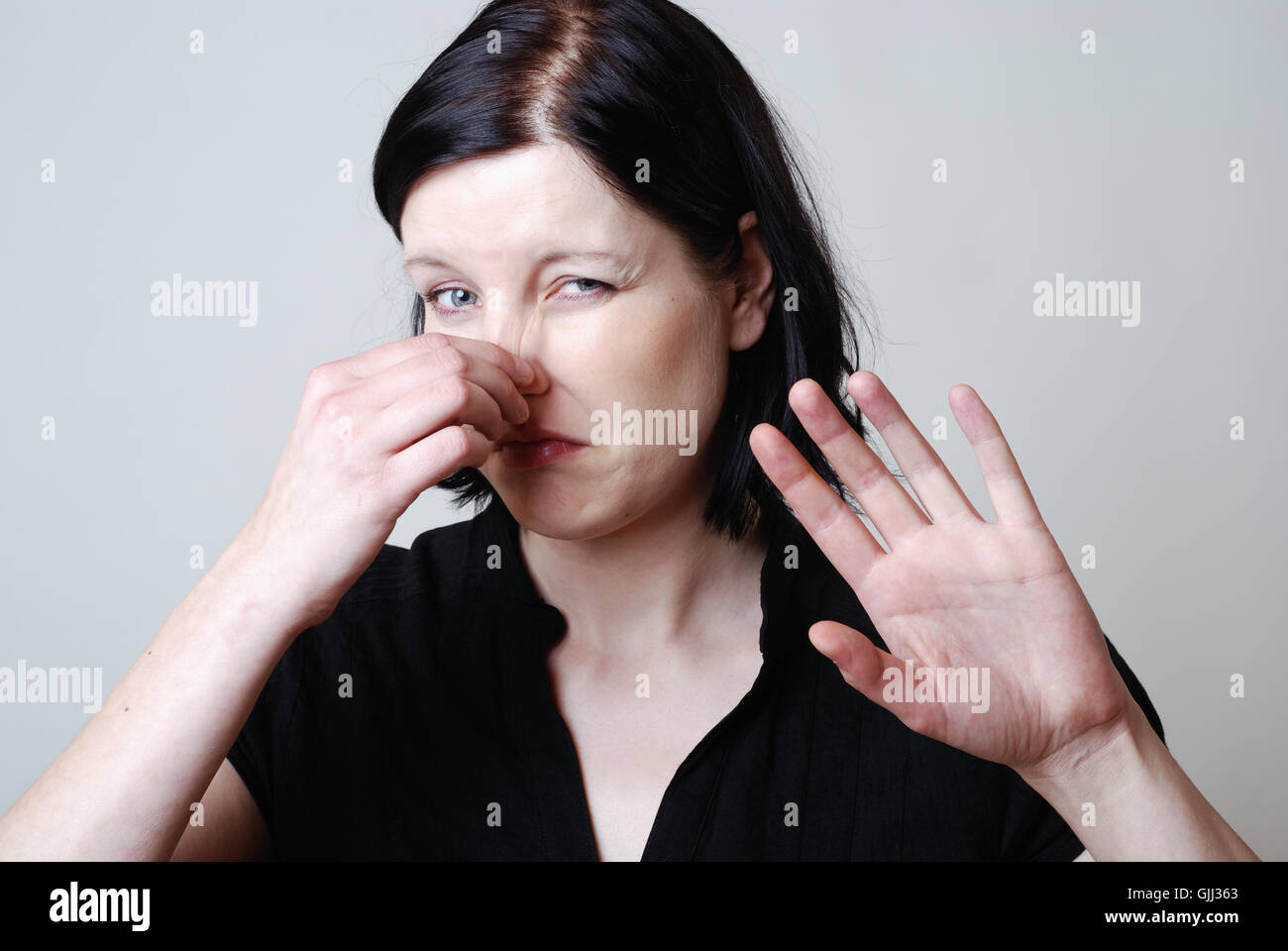 woman nose bad Stock Photo - Alamy