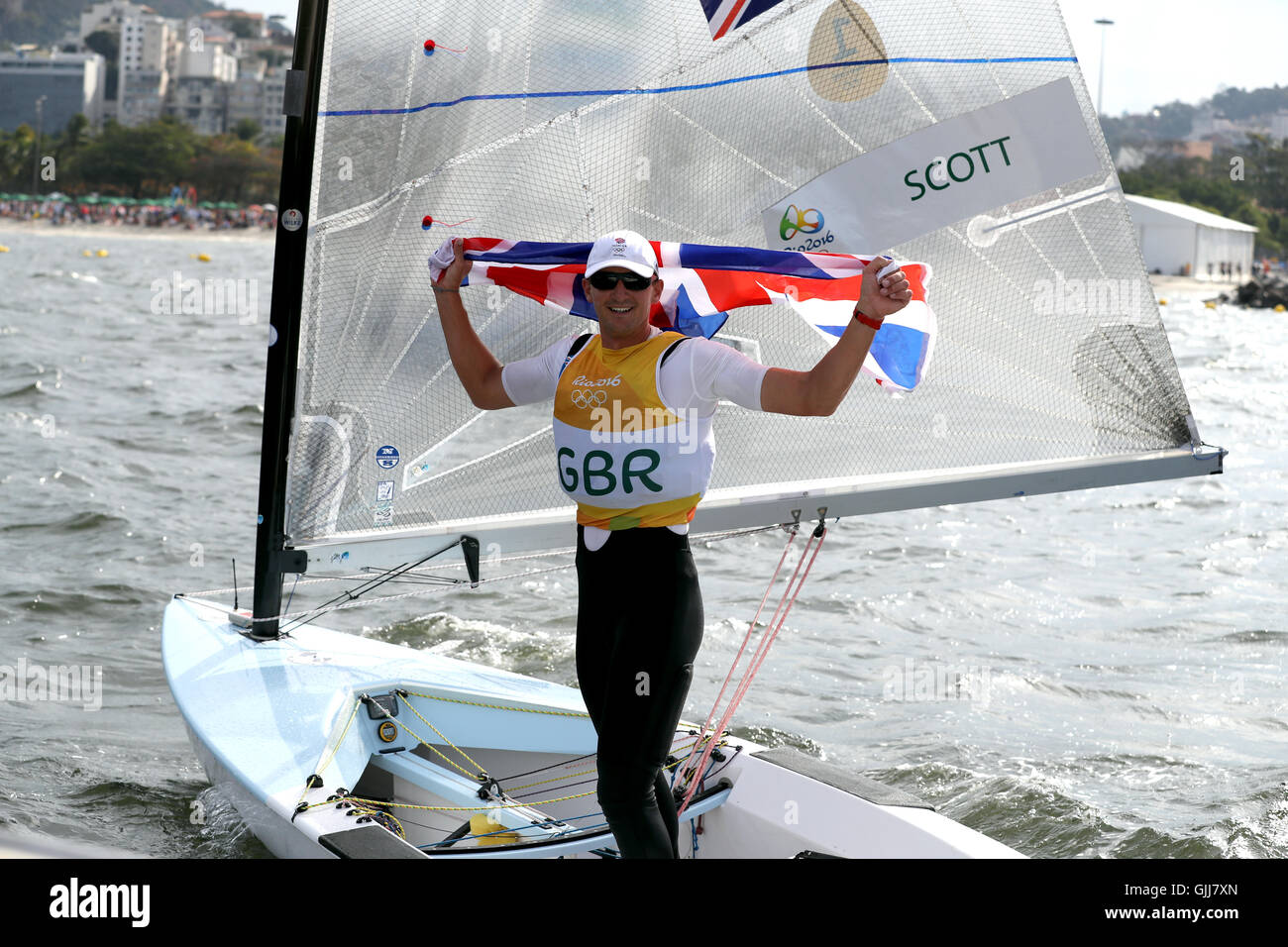 Great Britain's Giles Scott celebrates winning gold in the Men's Finn ...