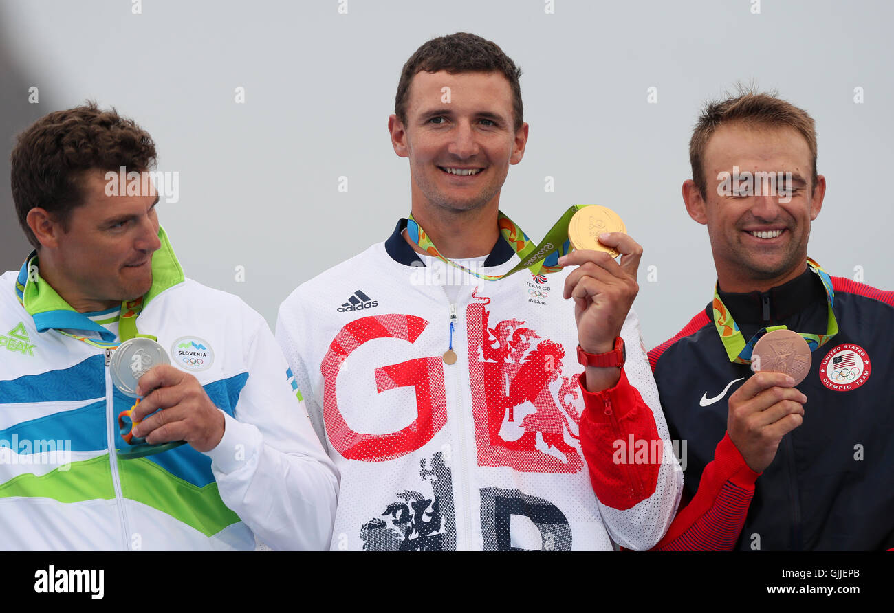 Great Britain's Giles Scott celebrates with his gold medal won in the ...