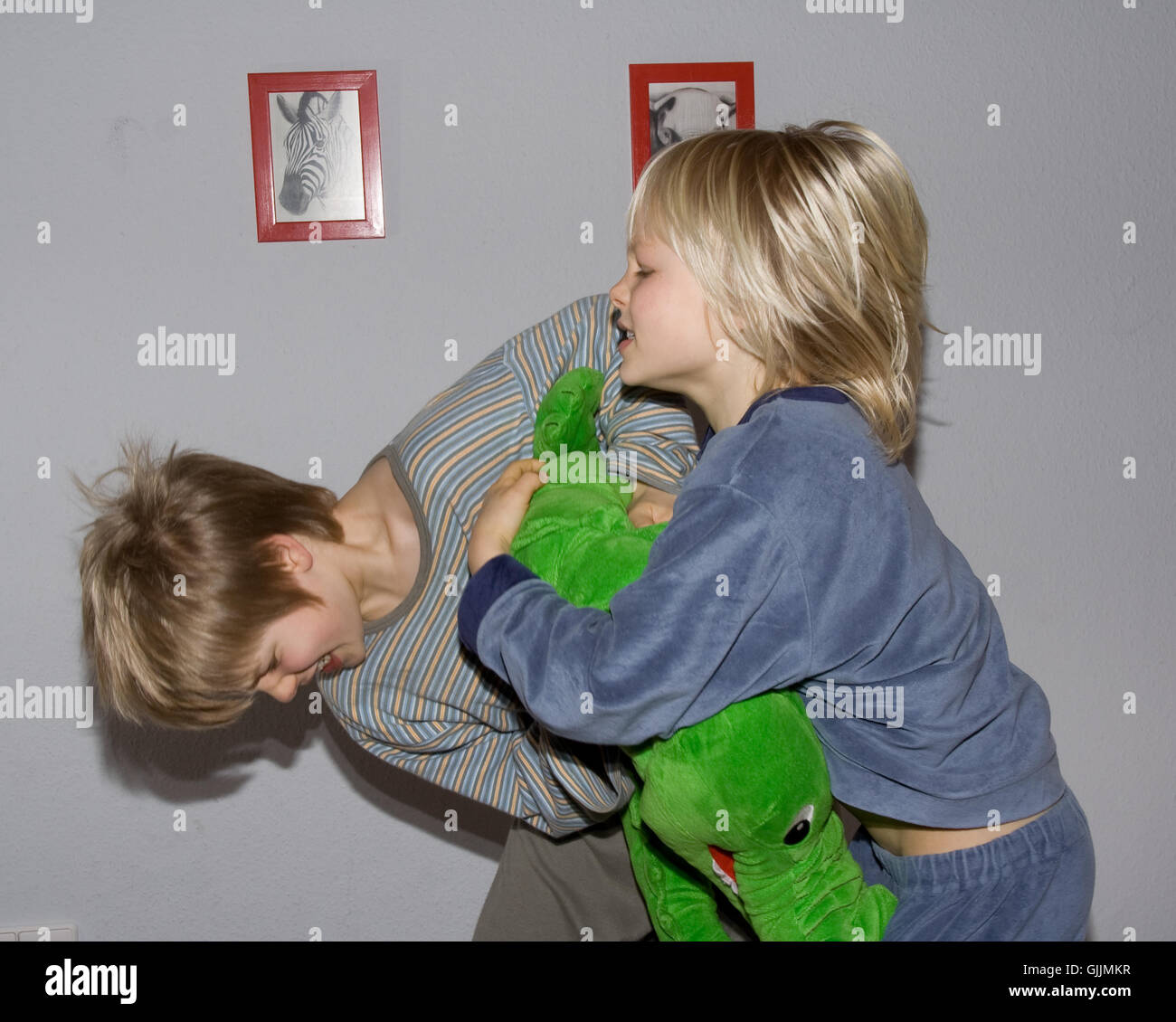 Kids fighting for toy hi-res stock photography and images - Alamy