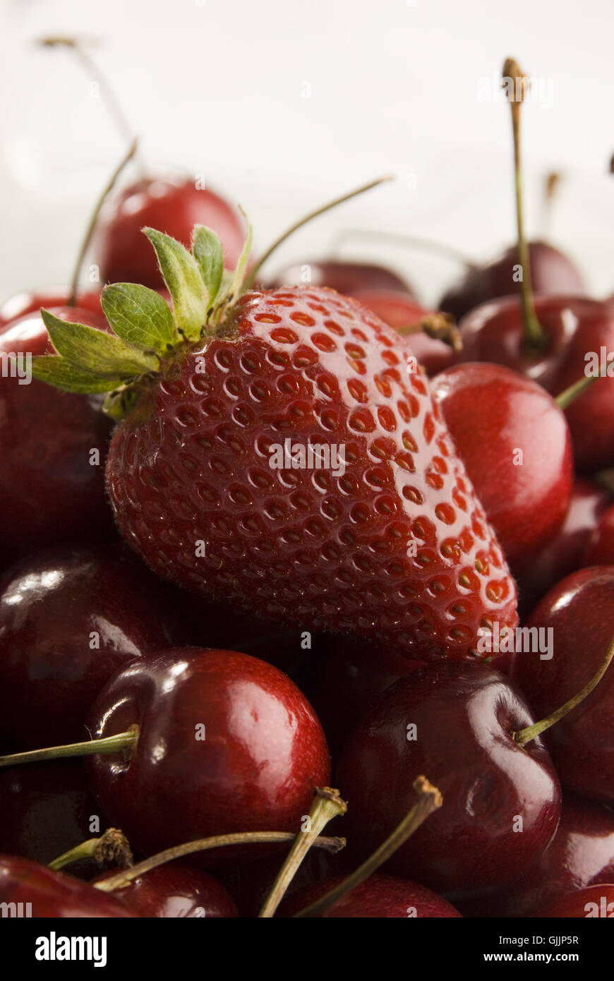 over strawberry cherry Stock Photo - Alamy