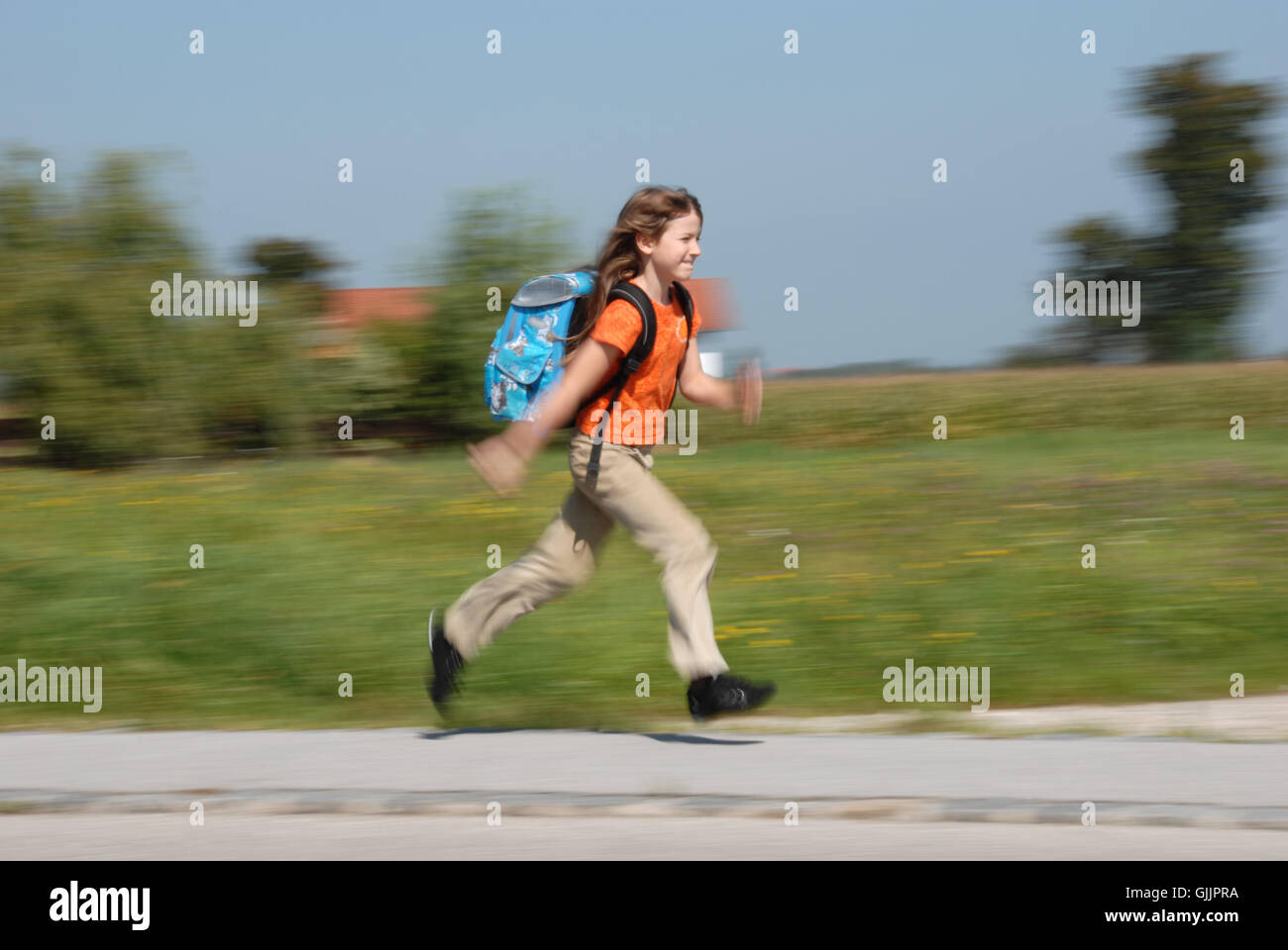 girl running to school Stock Photo - Alamy