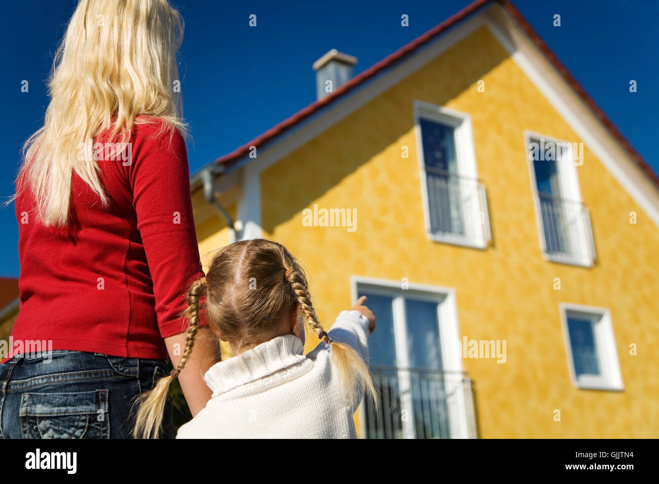 house building mother Stock Photo - Alamy