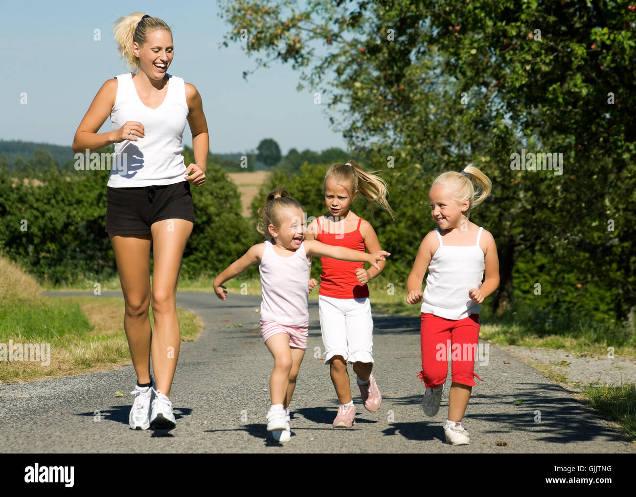 jogging in family Stock Photo - Alamy