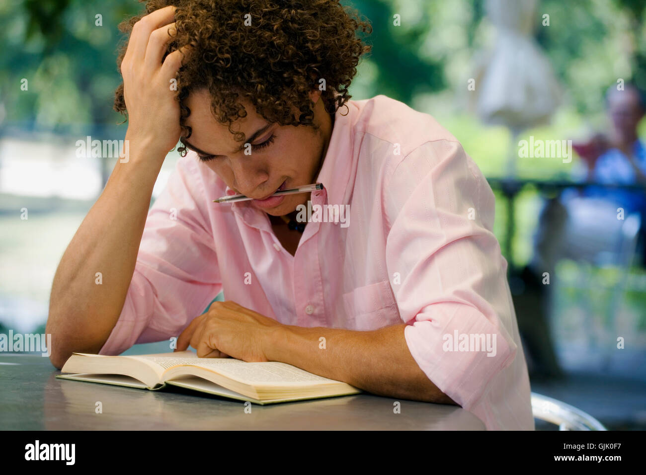 Young african man thinking writing hi-res stock photography and images ...