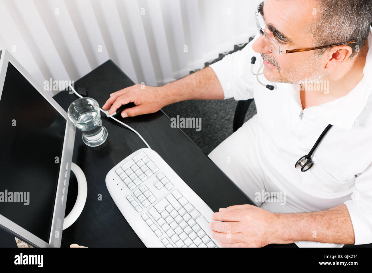 doctor working on computer Stock Photo - Alamy