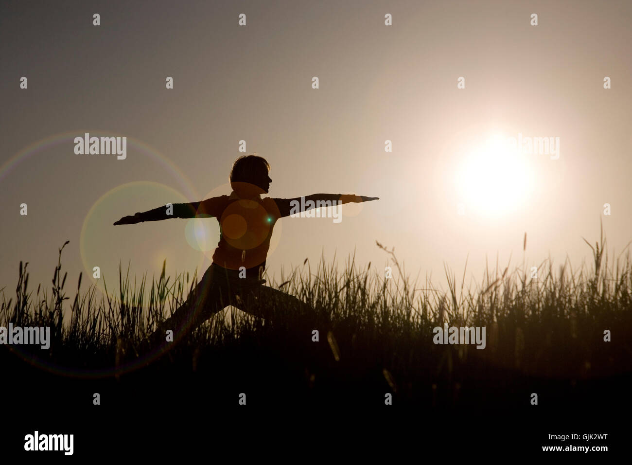 woman sunset sport Stock Photo - Alamy