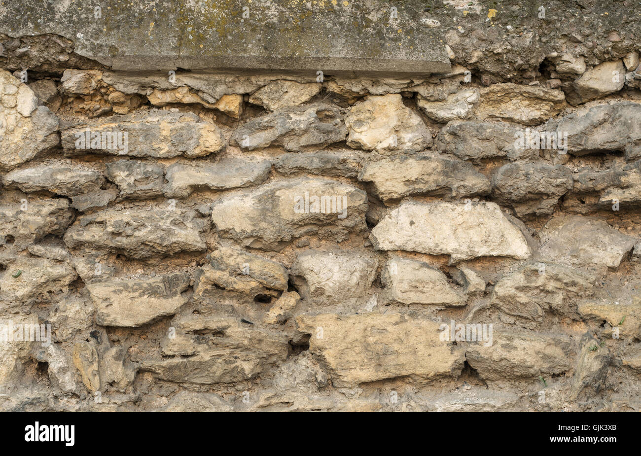 Old stone wall with signs of aging and weathering Stock Photo - Alamy