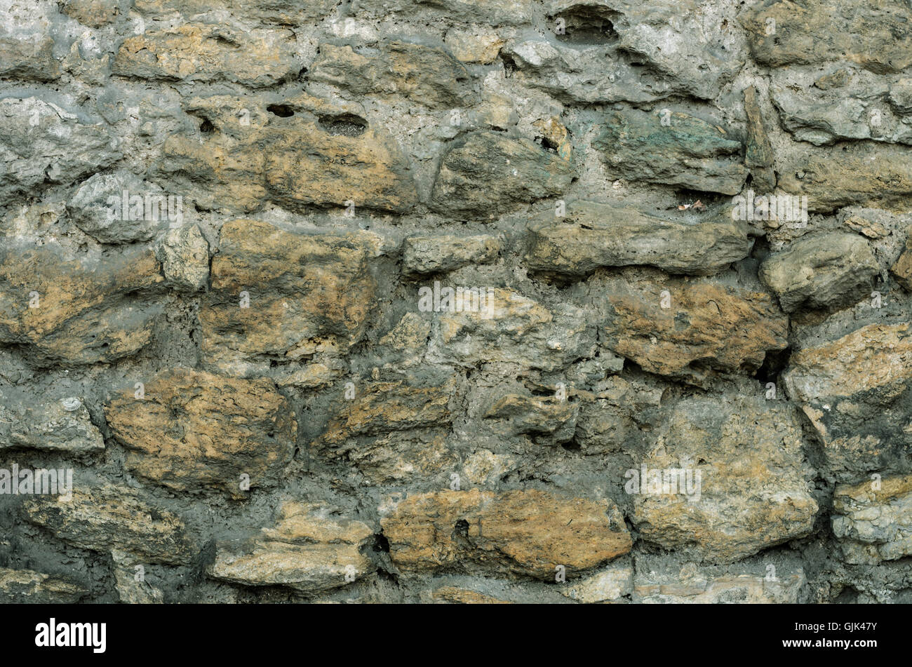 Old stone wall with signs of aging and weathering Stock Photo - Alamy