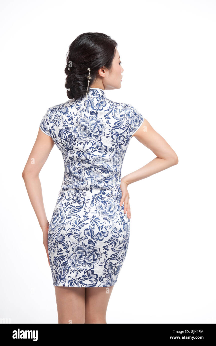 Dressed in traditional Chinese costumes studio shot young woman's back ...