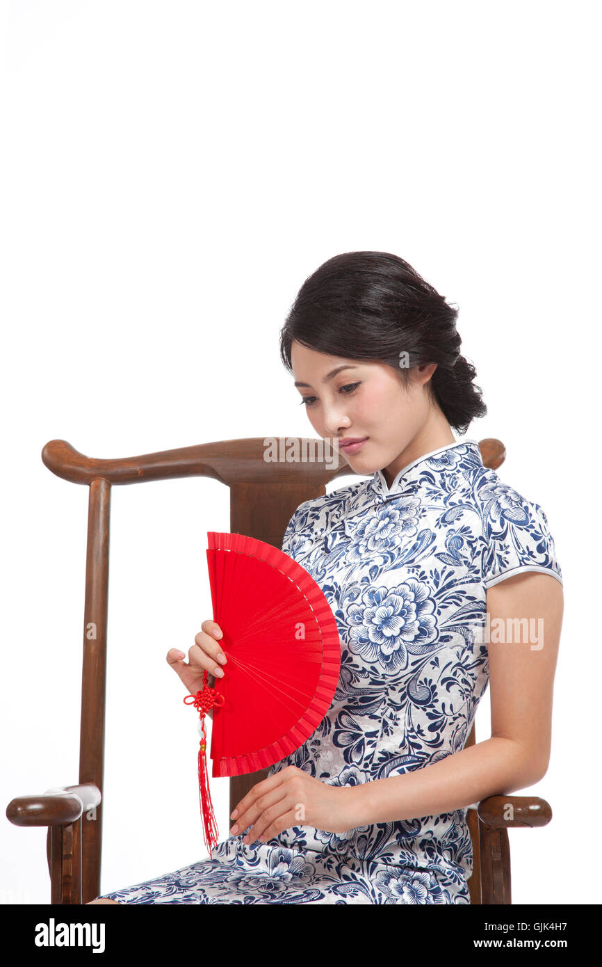Dressed in traditional Chinese costumes studio shot young Chinese woman ...