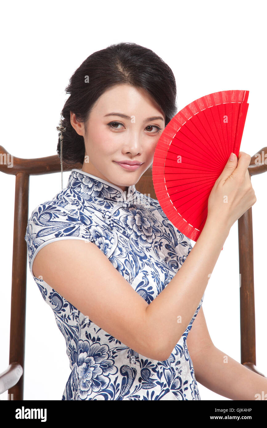Dressed in traditional Chinese costumes studio shot young Chinese woman ...