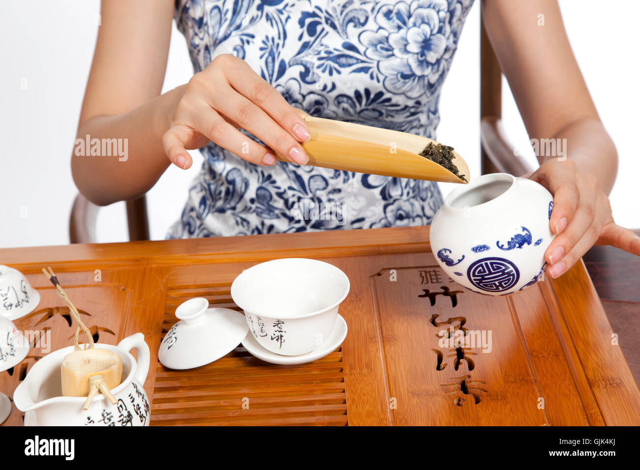 Dressed in traditional Chinese costumes studio shot young woman show ...