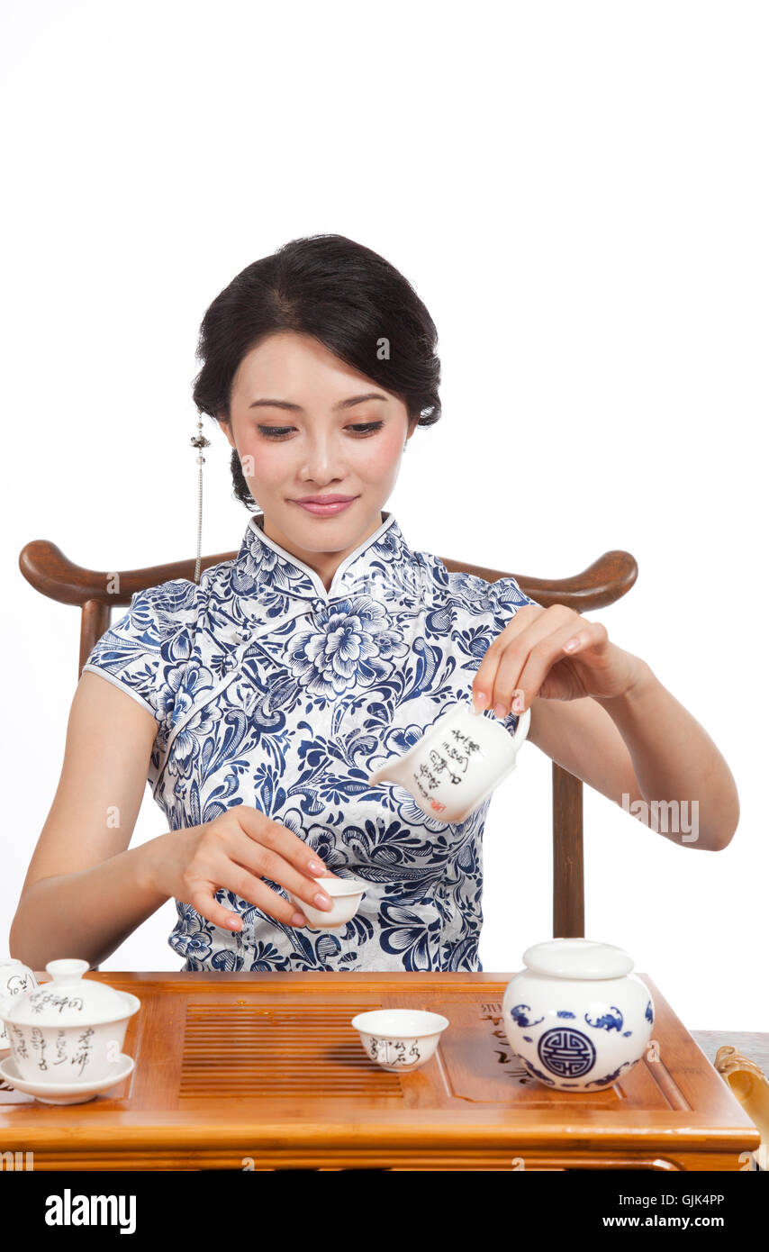 Dressed in traditional Chinese costumes studio shot young woman show ...