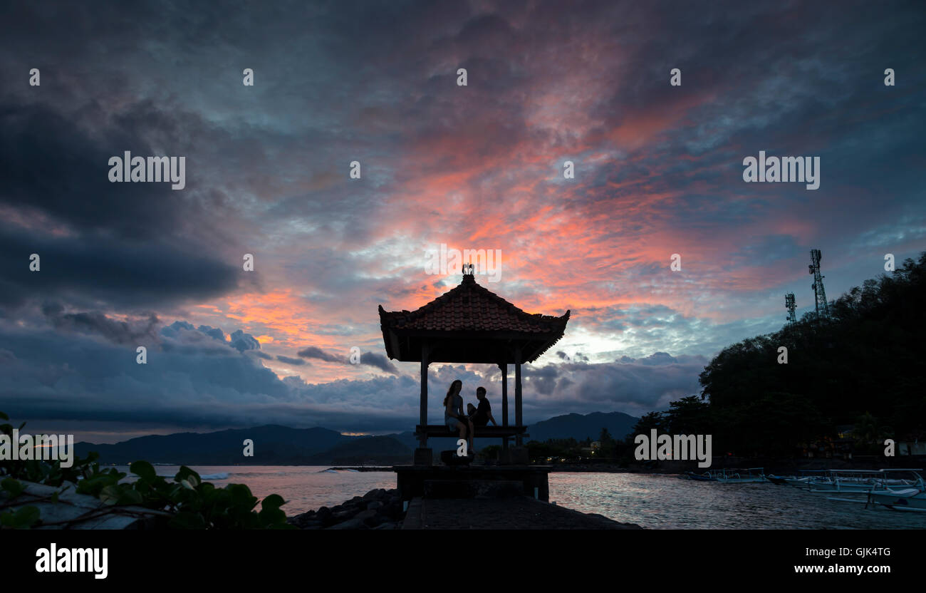 Sunset behind pagoda in Bali Stock Photo - Alamy
