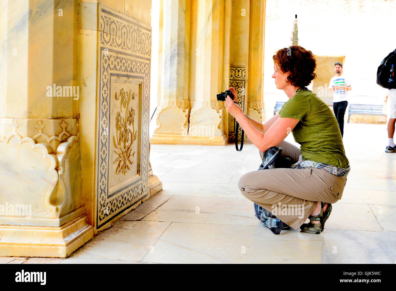 Foreigner tourist taking photograph of Indian wall artwork of Indian ...