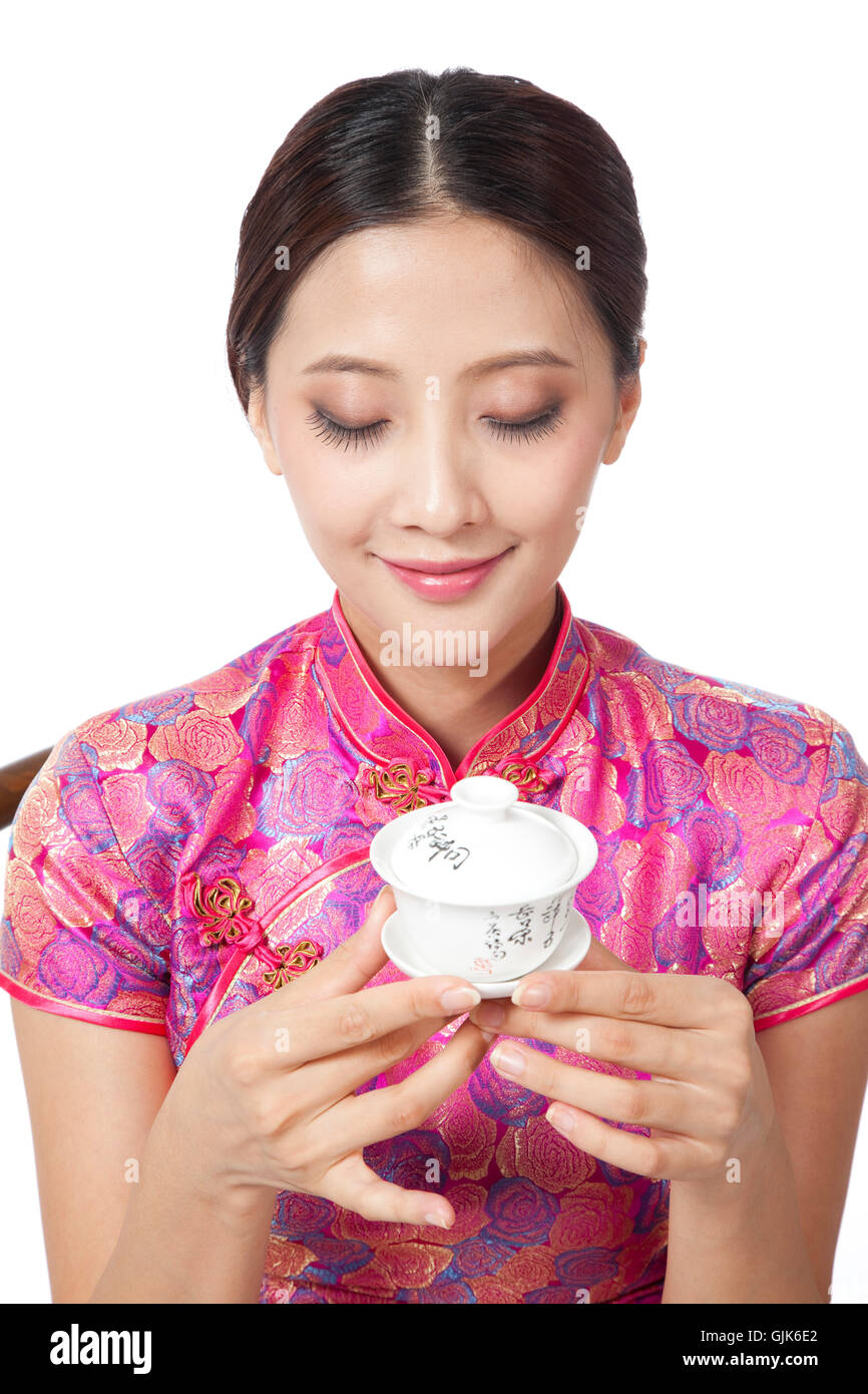 Dressed in traditional Chinese costumes studio shot young woman tea ...