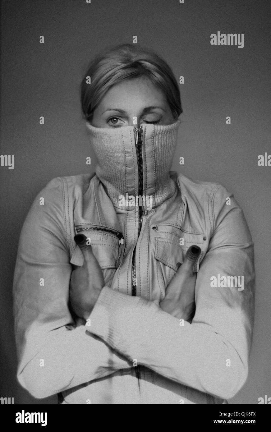 funny portrait of the young woman with one eye closed Stock Photo - Alamy