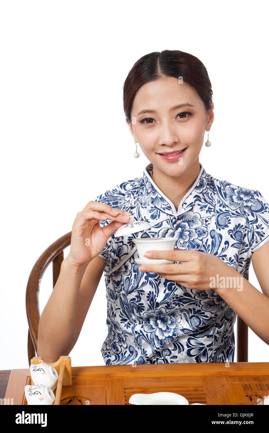 Dressed in traditional Chinese costumes studio shot young woman tea ...