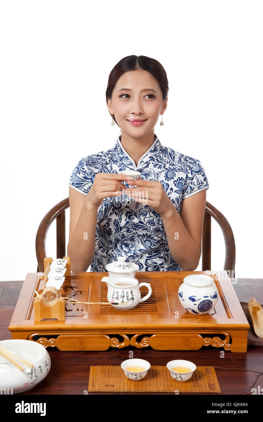 Dressed in traditional Chinese costumes studio shot young woman tea ...