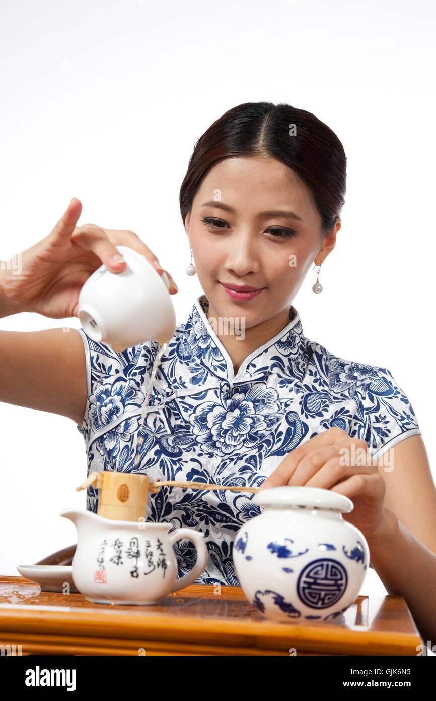 Dressed in traditional Chinese costumes studio shot young woman show ...