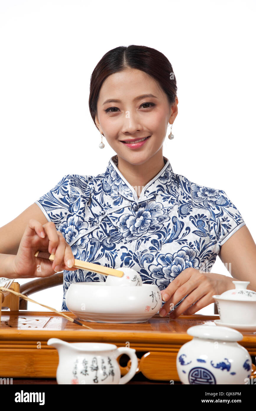 Dressed in traditional Chinese costumes studio shot young woman show ...