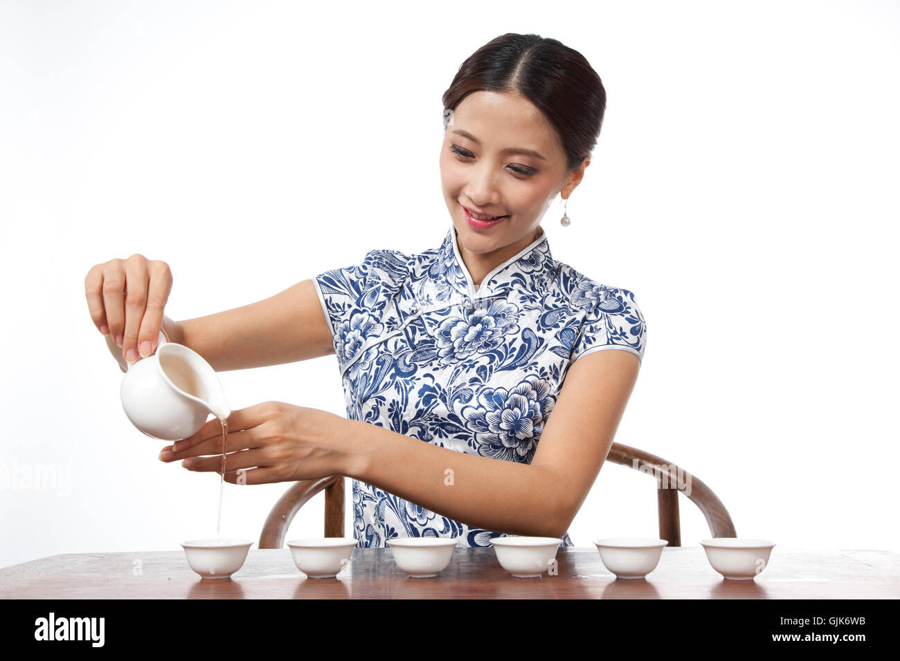 Dressed in traditional Chinese costumes studio shot young woman tea ...