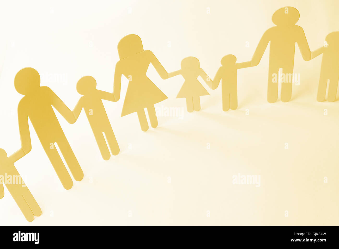 Family paper chain cutout holding hands Stock Photo - Alamy